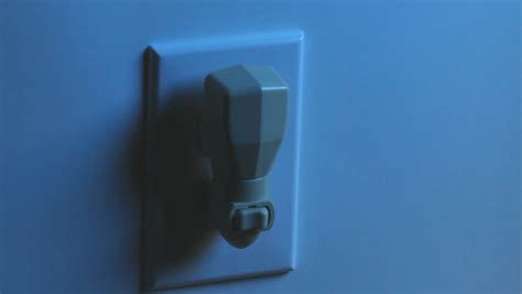 A Women S Hand Flips A Light Switch On The Nightlight To Turn It On And Then Turns It Off
