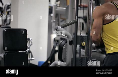 The Man In The Gym Trains Muscles Of Hands With A Block Circuit