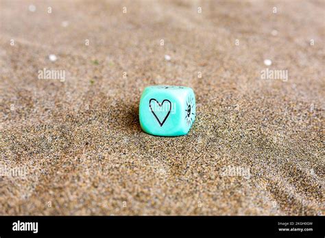 Heart And Sun Weather Symbols On Sides Of Blu Plastic Cube Funny