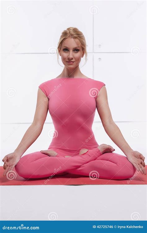 Beautiful Attractive Blond Woman Doing Yoga Sitting In The Lotus