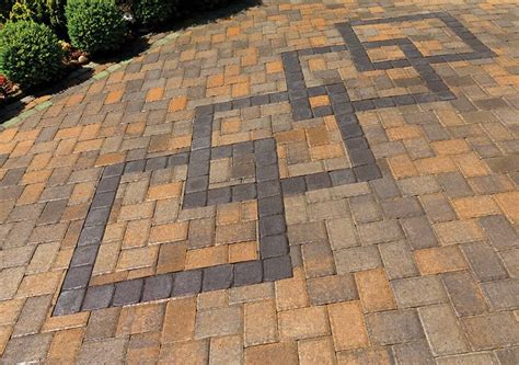 Multi Colored Pavers In A Random Pattern Accented With Four