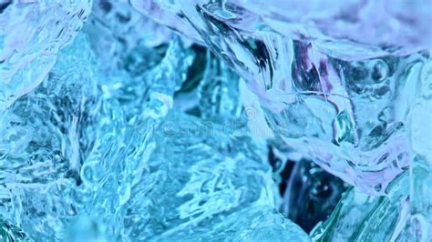 Super Slow Motion 1000 Fps Water Liquid Is Poured Out In Blue Ice Cubes