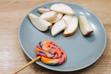 Colorful Lollipop Candy Apple Fruit On Plate Healthy Unhealthy Junk