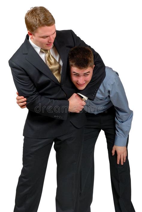 Headlock Young Man In A Business Suit Holding Another Young Man In A