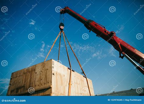 Crane Lifts A Container To Commercial Delivery Cargo Container Royalty