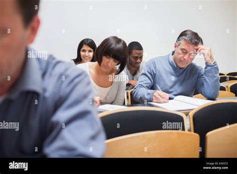 Adult Class Taking Notes Stock Photo Alamy