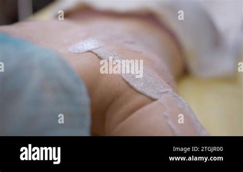 Close Up Shoulder Of Naked Woman In Shower Hat Lying In Beauty Spa