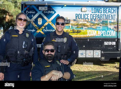 Long Beach Police Officers Posing In Front Of A Long Beach Police