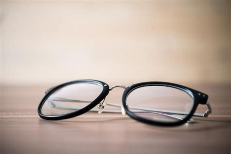 Premium Photo Black Glasses On Wooden Table Closeup A Black Glasses