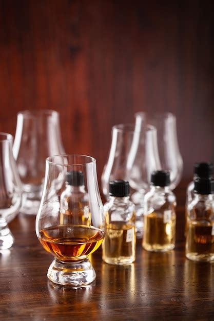 Premium Photo Tasting Bottles And Glasses Of Whisky Spirit Brandy