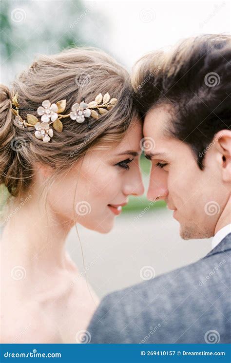 Groom Touches The Forehead Of Bride With His Forehead Portrait Stock