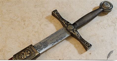 Excalibur King Arthurs Sword With Its Red Braided Scabbard Terressens