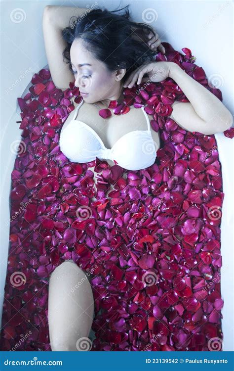 Woman Having A Bath With Rose Petals Stock Photo Image Of Care Face
