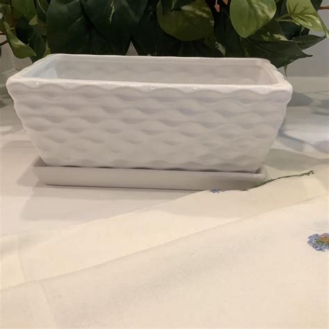 234 Two White Rectangular Planter With Faux Greens And Linen Runner
