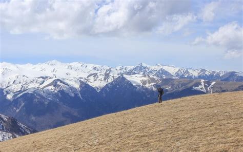 Premium Photo Man On A Background Of Snowcapped Peaks