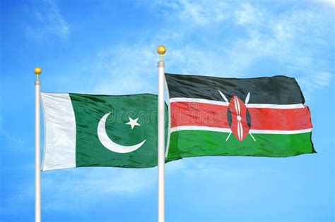 Pakistan And Kenya Two Flags On Flagpoles And Blue Cloudy Sky Stock