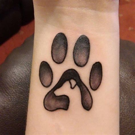 20 Amazing Paw Print Tattoos With Deep Connection TattoosWin Paw