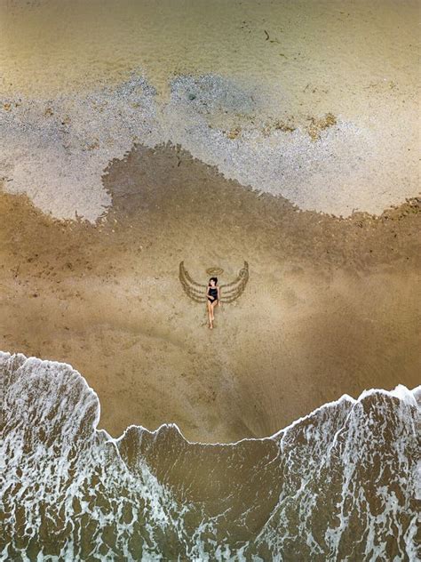 Female Angel On The Beach Drone Photo From Above Editorial Photography