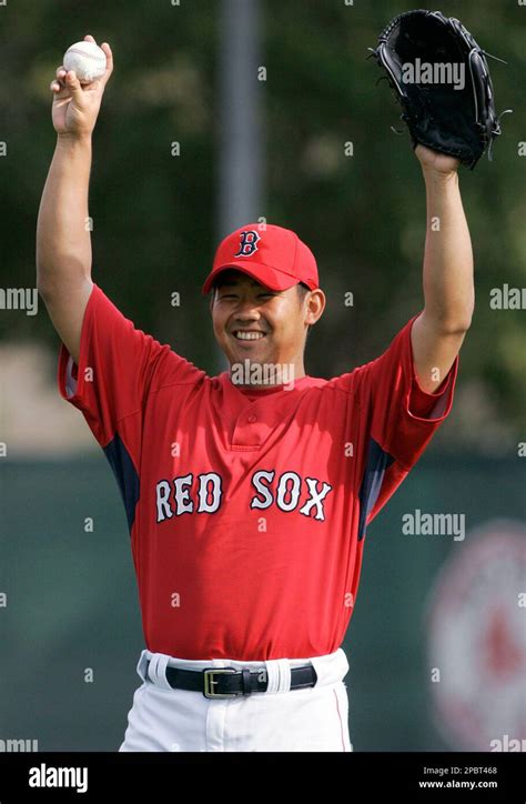 Boston Red Sox Pitcher Daisuke Matsuzaka Raises His Arms During A Team