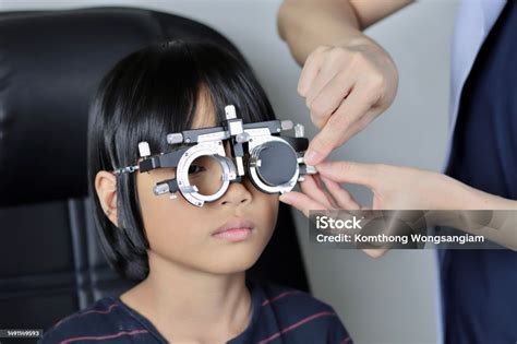 Elementary School Girl Wearing Eyeglasses Visual Acuity Test With Test Chart Eye Test Female