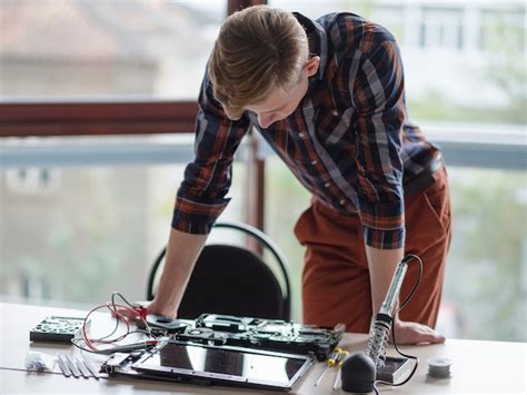 Premium Photo Computer Engineer Standing Over A Disassembled Laptop Science Technology