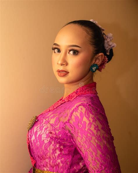Balinese Bride Wearing The Pink Wedding Dress Before The Ceremony Has