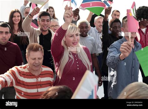 group of different people with their national flags striding forward
