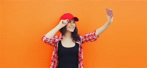 Premium Photo Happy Cheerful Smiling Young Woman Taking Selfie With