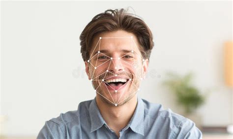 A Man With A Joyful Expression Showcases Facial Recognition Technology