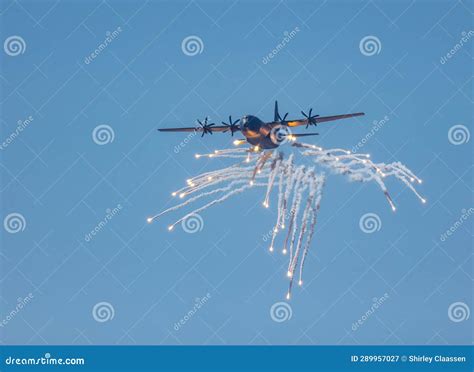 A Raaf Hercules Transport Aircraft Deploying Anti Missile Flares Stock Image Image Of
