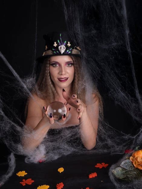 Premium Photo Woman In Hat Doing Magic With Crystal Ball