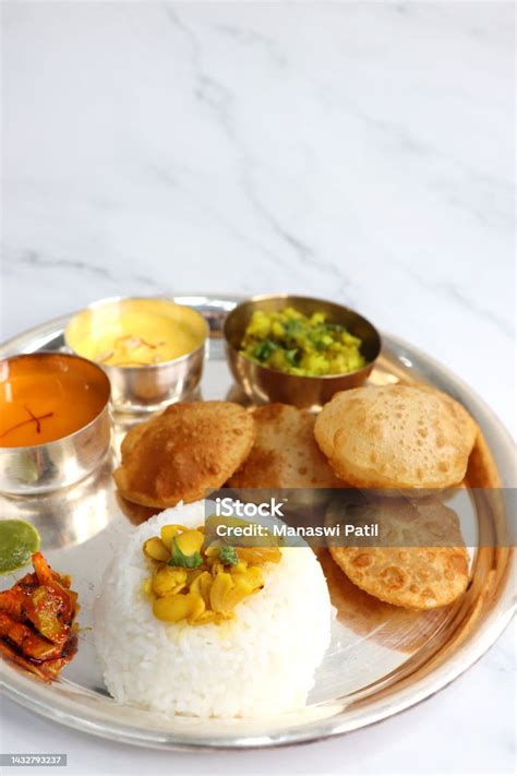 Indian Vegetarian Thali Or Platter Includes Aloo Ki Sabji Dal Rice Puri