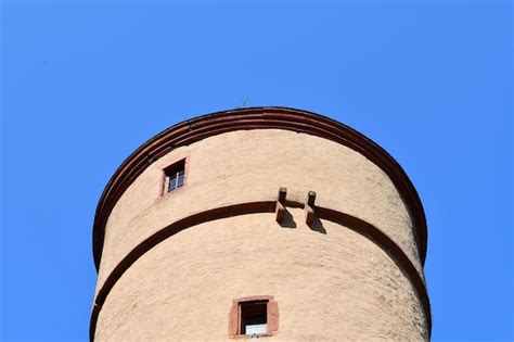 Premium Photo The Side Of A Tower To Small Mansion