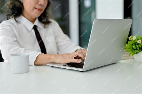 Premium Photo Professional Asian Senior Businesswoman Using Laptop Typing On Keyboard Working