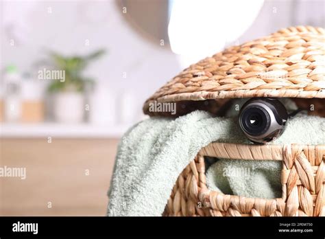 Camera Hidden Near Towel In Laundry Basket Indoors Space For Text