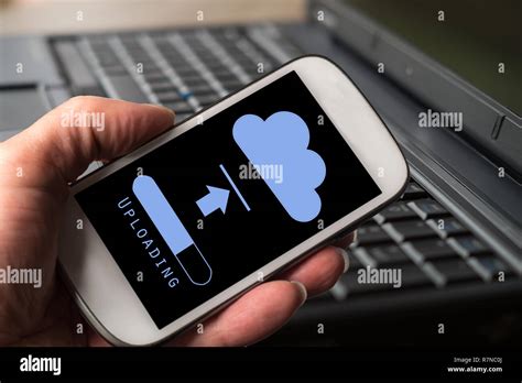 Hand With Smartphone Using Smartphone To Upload Data Cloud Computing
