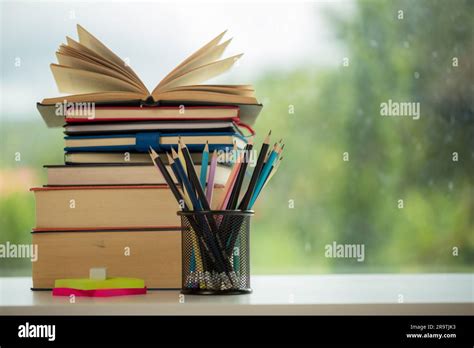 Object Education Green Nature Background With Stack Of Ancient Books Or Old Bible Open Paper