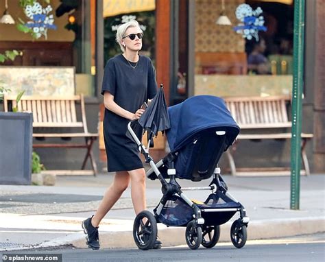 Agyness Deyn Keeps Things Casual In A Black T Shirt Dress As She Takes