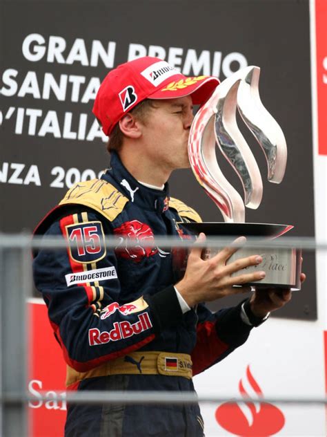 Caption Celebrated F1 Racer Sebastian Vettel Kissing His Coveted