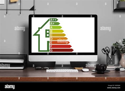 Energy Efficiency Rating On Display Workplace With Modern Computer