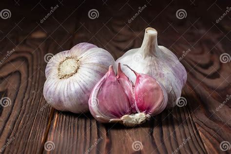 Garlic Cloves On Wooden Table Fresh Peeled Garlics And Bulbs Stock
