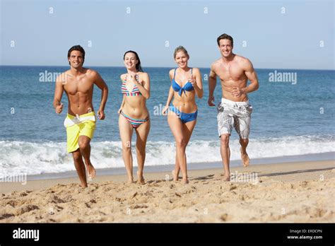 Group Of Friends Enjoying Beach Holiday Stock Photo Alamy