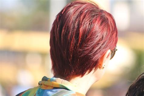 Premium Photo Rear View Of Redhead Woman With Short Hair
