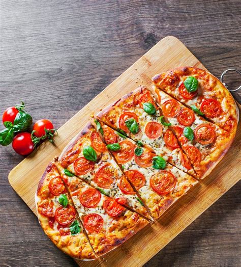 Oval Pizza With Mozzarella Cheese Tomatoes Pepper Spices And Fresh