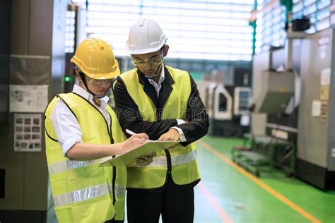 Factory Female Inspector Or Manager Take Note On Audit Report Stock