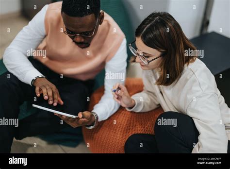 Multiracial Corporate Team Collaborating And Brainstorming On Business Growth And Profitability