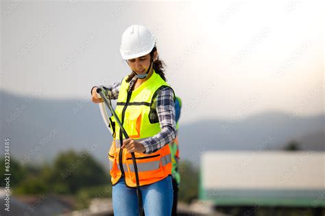 Electrician Pulling Wire Into PVC Pipe Electrical Engineering Female Installing Solar Cell