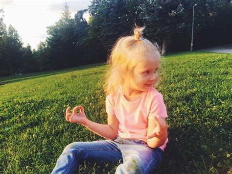 Premium Photo Happy Girl Sitting On Grass