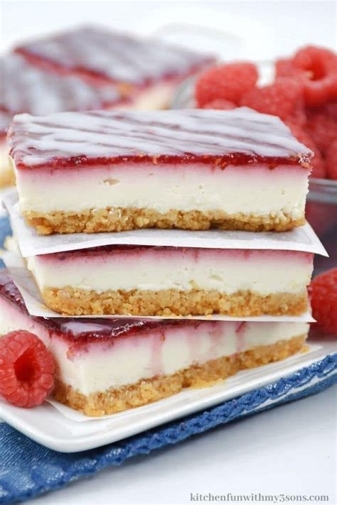 Raspberry Cheesecake Bars Stacked On Top Of Each Other