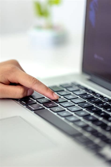 the girl is typing on the laptop keyboard girland x27 s hands on the